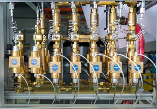 Screw-in valves for controlled flow